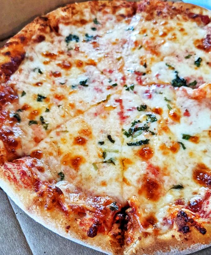 Sometimes simplicity is the ultimate sophistication &ndash; this four-cheese masterpiece with fresh basil proves less can indeed be more.