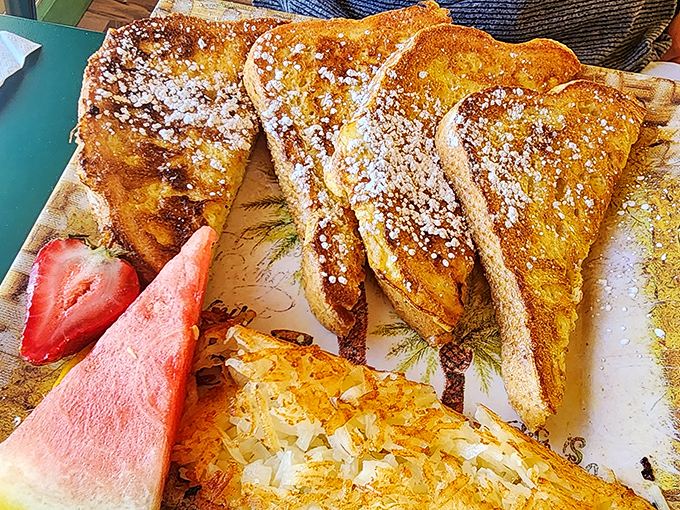 French toast that makes you question all other French toast &ndash; golden, custardy perfection dusted with powdered sugar and begging for maple syrup.