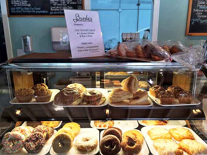 The display case – where willpower goes to die and "I'll just have one" becomes the day's first little white lie.