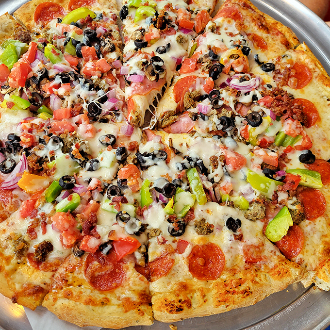 A colorful mosaic of toppings creates a flavor symphony where every ingredient plays its part perfectly without overwhelming the ensemble.