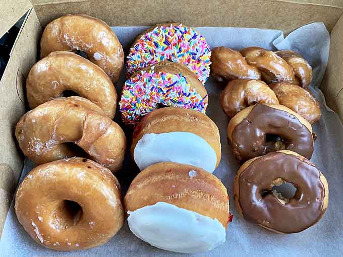 A box of assorted donuts showcases the rainbow of possibilities &ndash; from classic glazed to chocolate-dipped and sprinkle-topped creations that spark joy.