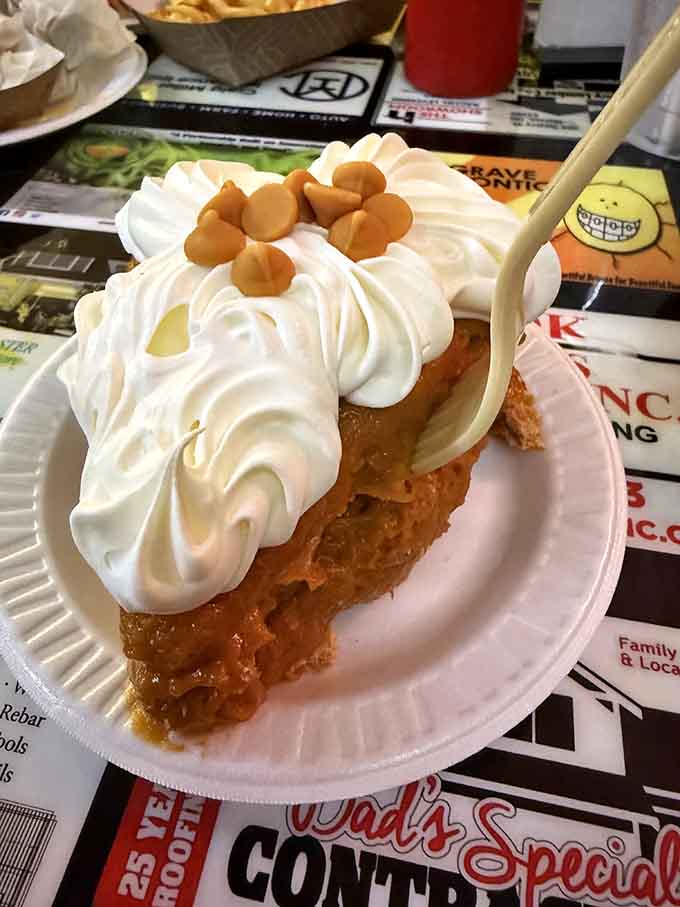 Butterscotch pie topped with clouds of whipped cream, because every great meal deserves a sweet ending.