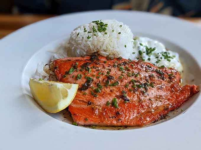 Wild Alaskan Sockeye Salmon arrives with jasmine rice, proving that pub food can be both hearty and refined.