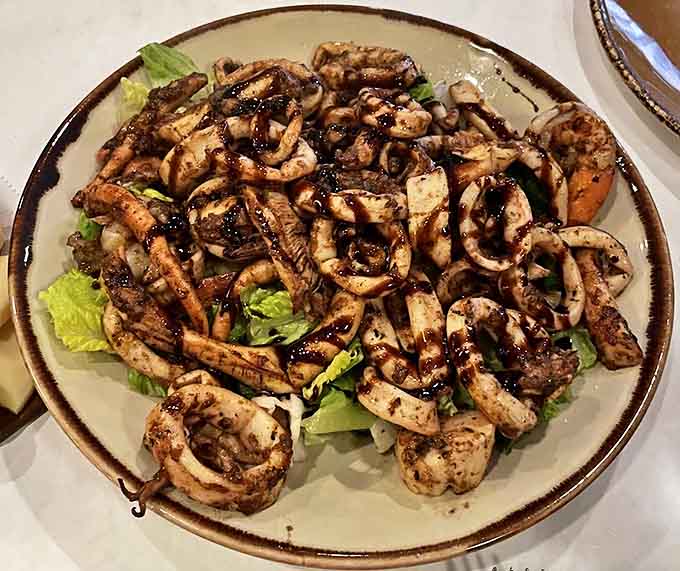 This grilled seafood platter looks like the Mediterranean decided to throw a party on your plate, and everyone's invited.