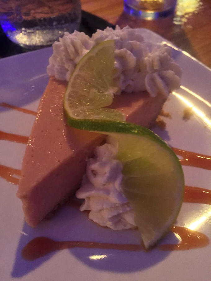 Lime slices add a fresh, zesty garnish to the creamy pie, offering both visual appeal and a hint of what awaits with each heavenly bite.