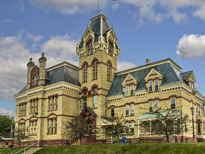 The Houghton County Courthouse stands as a yellow sandstone testament to the area's prosperous mining era, its clock tower keeping time for generations.