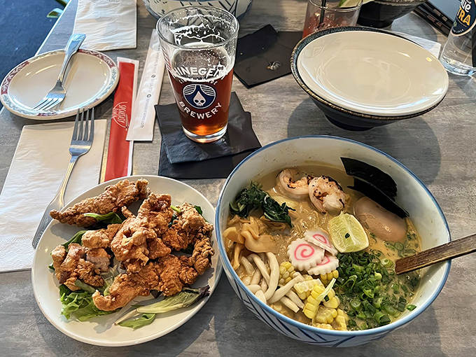 A perfect pairing: crispy Japanese fried chicken alongside a steaming bowl of ramen, with a local craft beer to tie it all together.