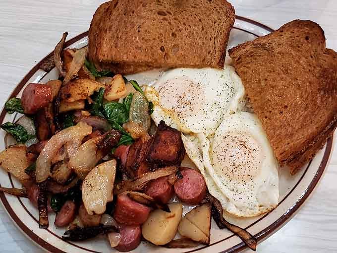 This breakfast platter brings together eggs, potatoes, and toast in a combination that's been fueling Minnesotans through cold mornings since before avocado toast was even a thing.