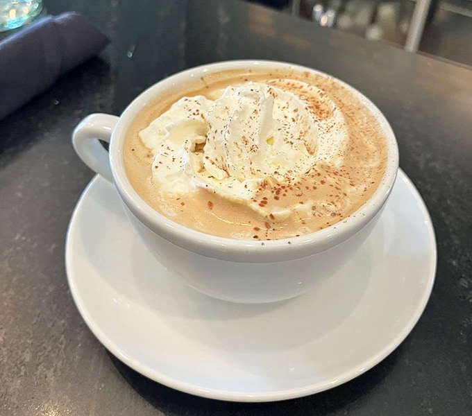 Topped with whipped cream and a dusting of cocoa, this mocha is basically a hug in a cup.
