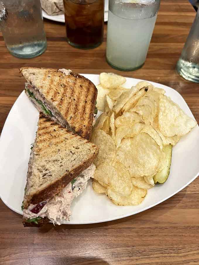 A tuna salad sandwich that elevates the lunchtime classic with kettle chips for that essential crunch factor.