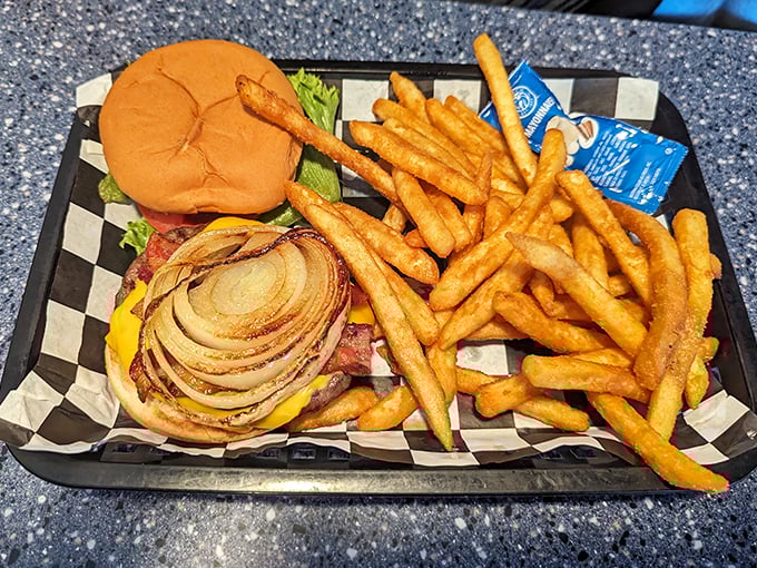 A burger with gravitational pull, accompanied by fries that vanish quicker than you can say "unidentified frying objects."