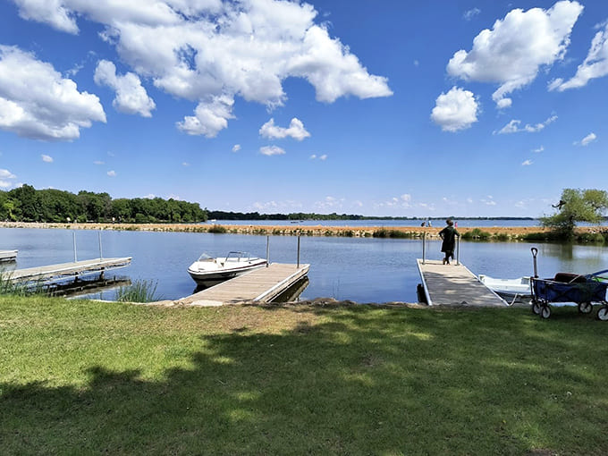 Wooden docks extend into calm waters, inviting you to sit, dangle your feet, and contemplate absolutely nothing for a while.