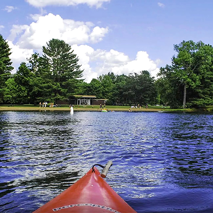 Lake St. Catherine's crystal waters invite exploration by kayak, where each paddle stroke reveals new perspectives of Vermont's natural beauty.