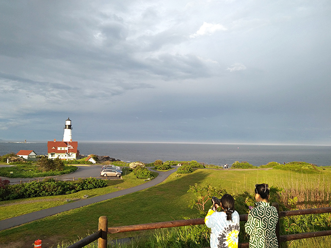 Visitors stroll the grounds of Fort Williams Park, where every pathway leads to another frame-worthy view of America's most photogenic lighthouse.