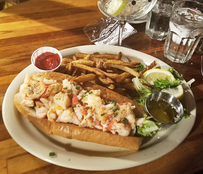 A lobster roll fit for royalty &ndash; succulent chunks of sweet meat nestled in a buttery roll, with crispy fries standing guard.