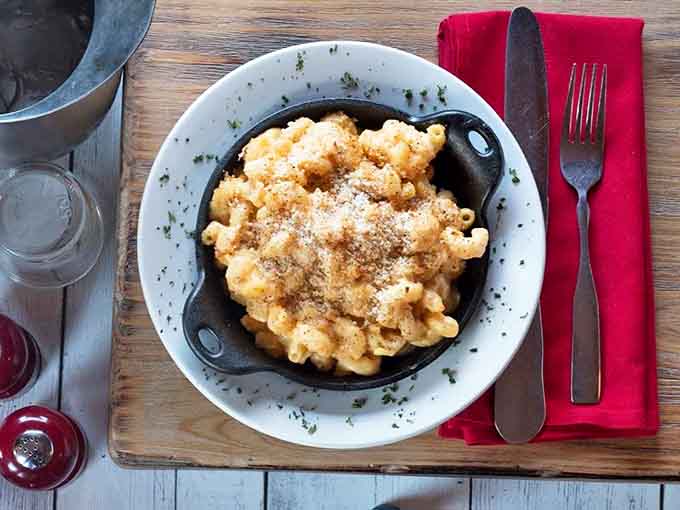 This isn't your boxed mac and cheese &ndash; it's a creamy, golden masterpiece topped with crispy breadcrumbs that elevate comfort food to art form.
