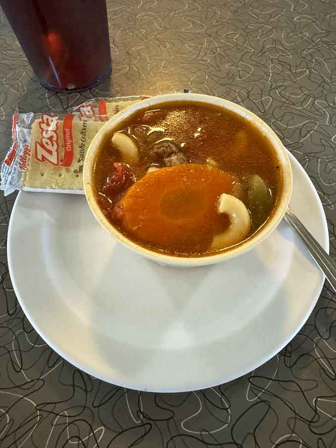 Hearty burger meets soul-warming macaroni soup in a combination that perfectly captures the diner's commitment to satisfying comfort food.