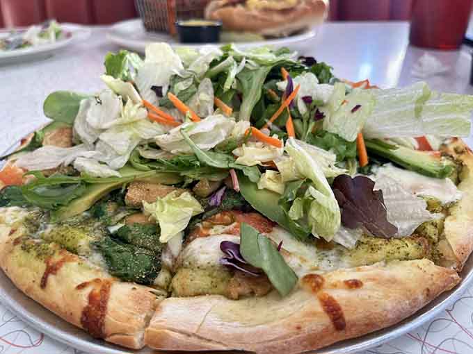 Who says diners can't do pizza? This Catalina creation topped with fresh greens proves fusion can work beautifully.