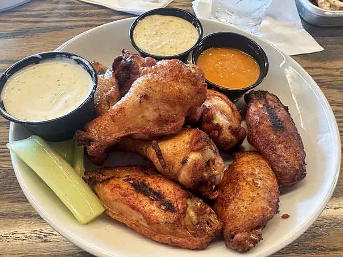 Smoked chicken wings with multiple sauce options prove that poultry deserves just as much barbecue love as beef and pork.