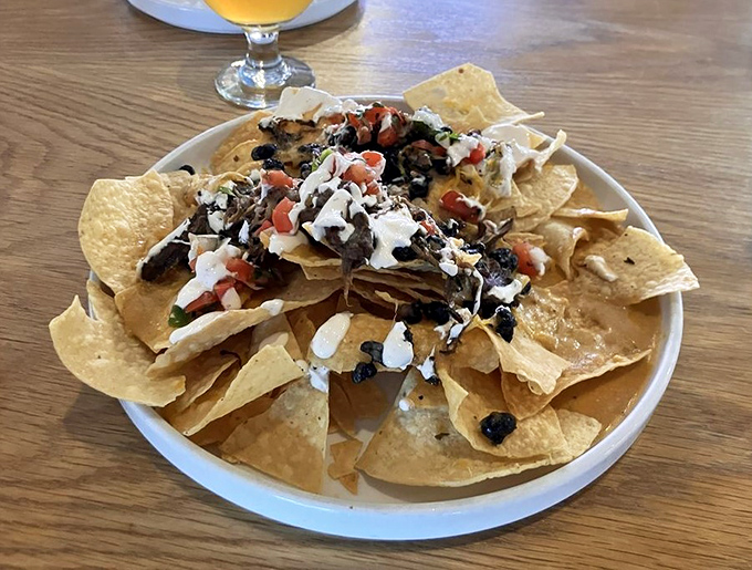Not your average bar nachos&mdash;these chimichurri-drizzled, cheese-laden chips create the kind of sharing dilemma that tests friendships.