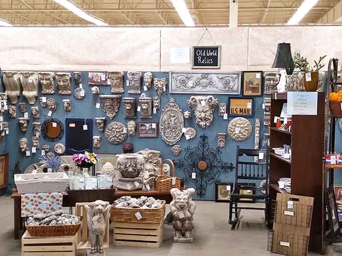 Wall-mounted architectural salvage pieces transform ordinary walls into conversation starters. These ornate fragments once adorned buildings with stories to tell.