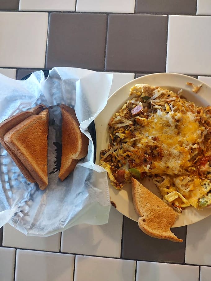 A fluffy masterpiece stuffed with savory fillings and melty cheese, paired with golden toast. Breakfast perfection that's worth getting out of bed for!