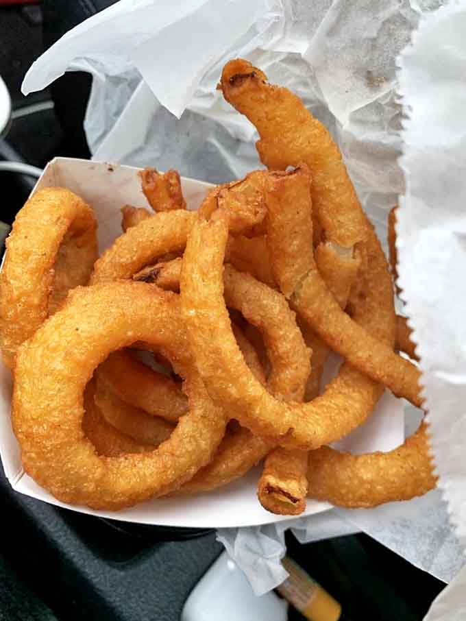 Crispy, golden halos of happiness with that perfect crunch-to-onion ratio that chain restaurants can only dream about achieving.