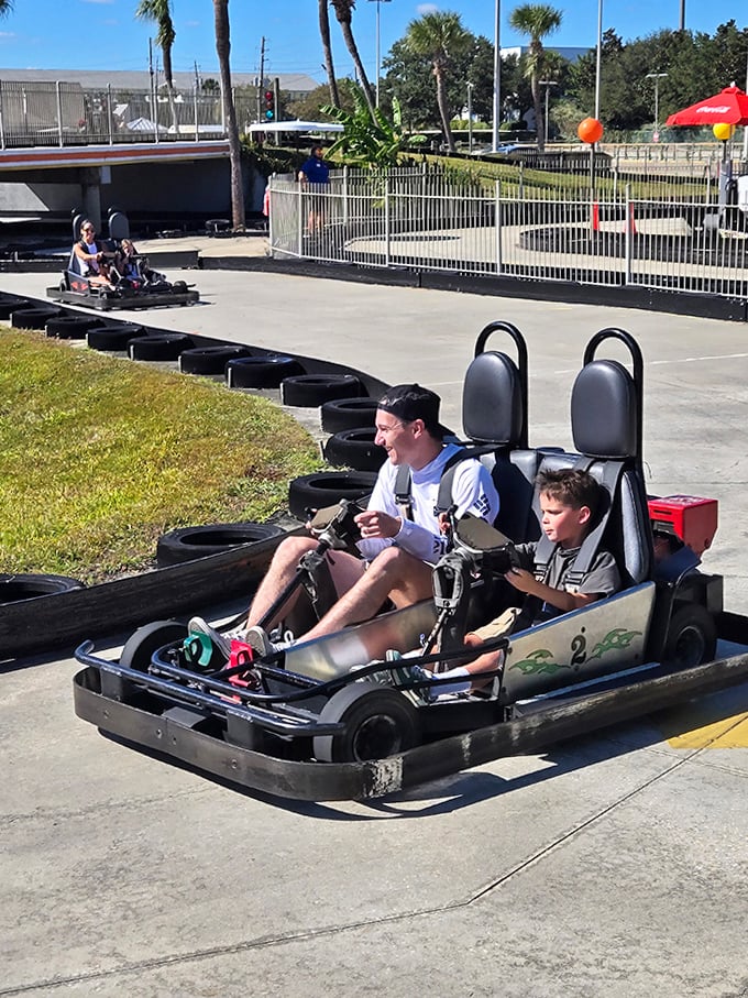 Wooden beams frame the outdoor track like a roller coaster's country cousin – architectural poetry for speed enthusiasts.