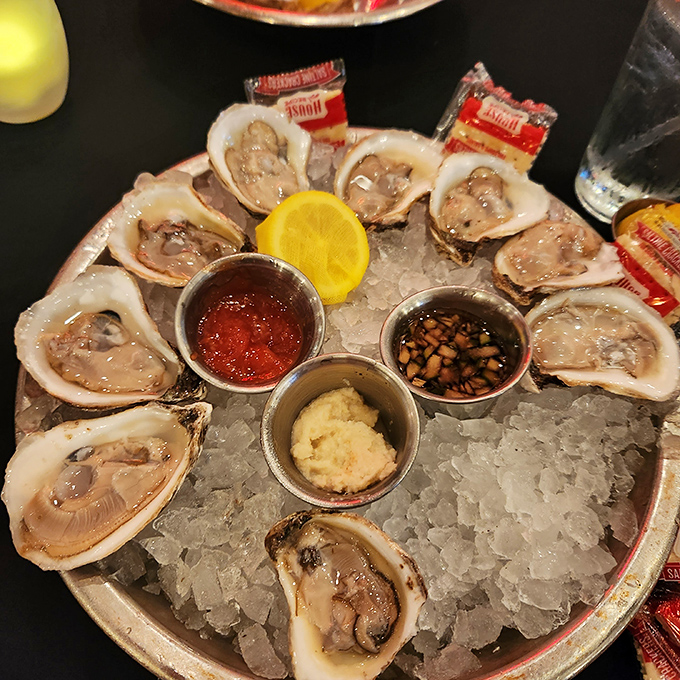 Fresh oysters nestled on ice like pearls in a treasure chest, waiting to deliver that perfect briny kiss with each slurp.