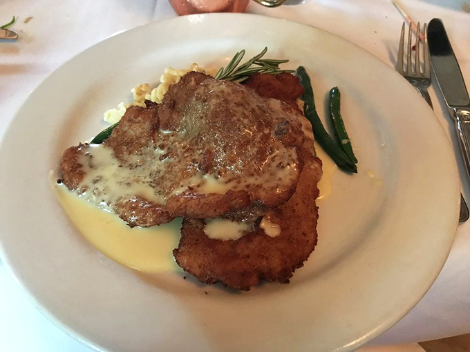 The filet mignon arrives like royalty, crowned with compound butter that slowly melts into a sauce worth bottling and taking home.