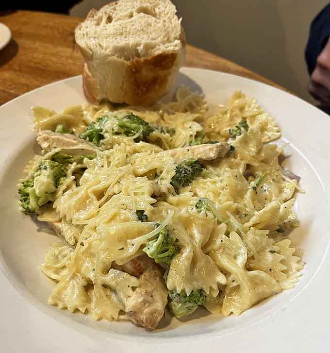 Creamy Alfredo pasta with chicken and broccoli proves this kitchen handles more than just beef with impressive skill and care.