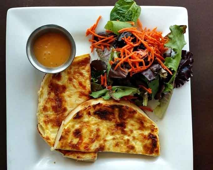 Four cheeses walk into a quiche, and the result is this glorious creation that makes lactose tolerance worth celebrating.