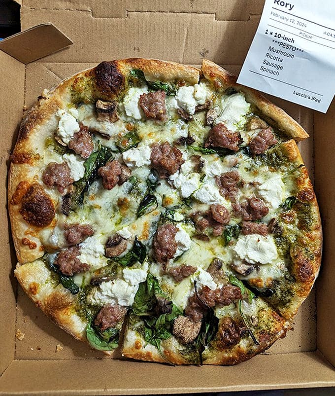 Pesto pizza perfection with pepperoni polka dots &ndash; the kind of green-and-red combination that makes every day feel like Christmas for your taste buds.