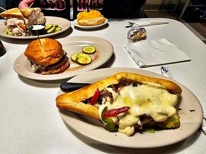 Philly cheesesteak perfection with peppers and onions nestled under a gooey cheese blanket &ndash; napkins required, no exceptions.