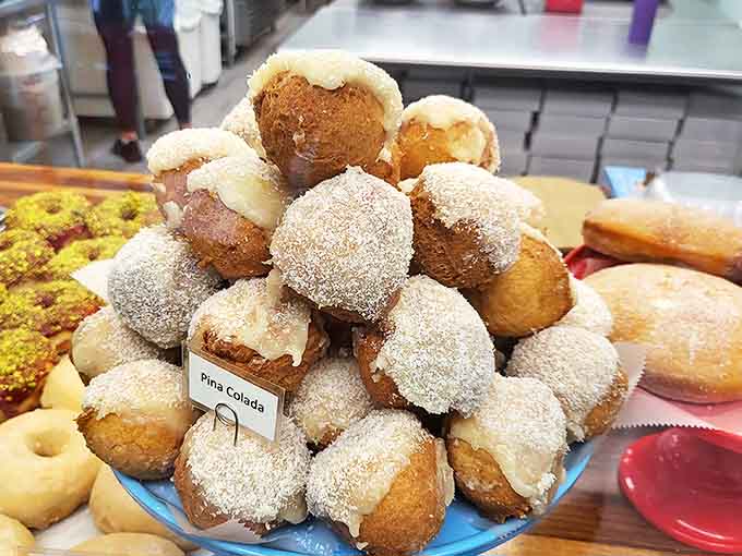 These Pi&ntilde;a Colada donut holes, rolled in coconut sugar, deliver tropical vacation vibes without the airfare or awkward tan lines.
