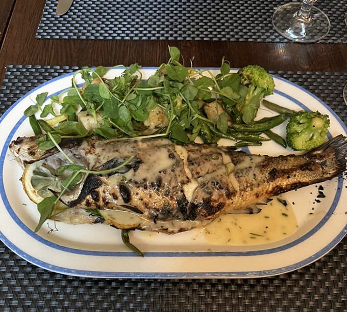 Whole branzino prepared so beautifully it almost seems rude to eat it, but you will anyway.
