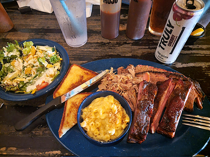 Tender strands of smoky pork that spent hours contemplating life in the smoker before surrendering to your fork with dignity.