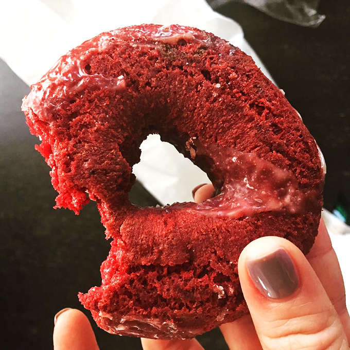 This isn't just a red velvet donut; it's a crimson masterpiece with subtle cocoa notes that makes ordinary donuts blush with inadequacy.