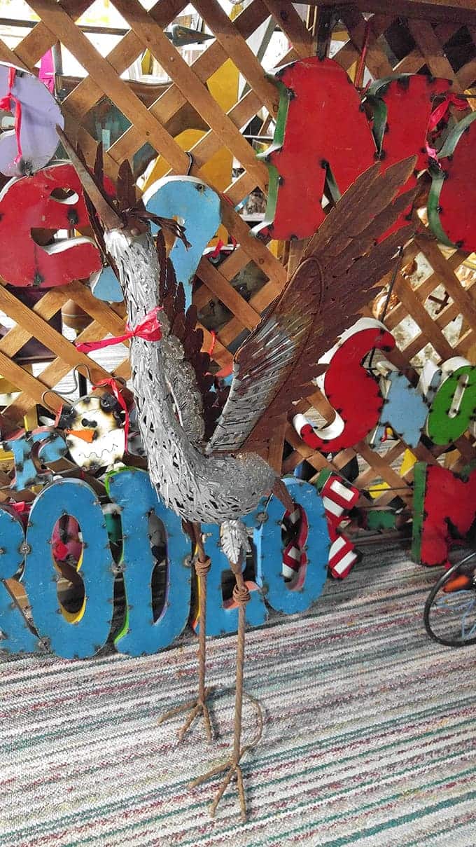 This metal crane stands tall among the treasures, looking distinguished despite being made from materials that once served entirely different purposes.