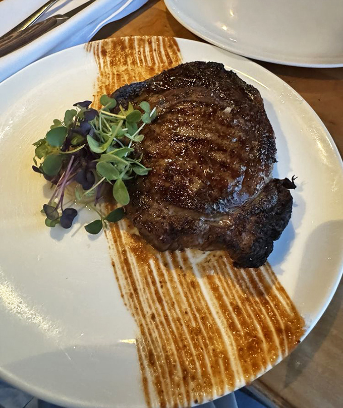 A perfectly seared ribeye proves this seafood-centric kitchen knows its way around land offerings too.
