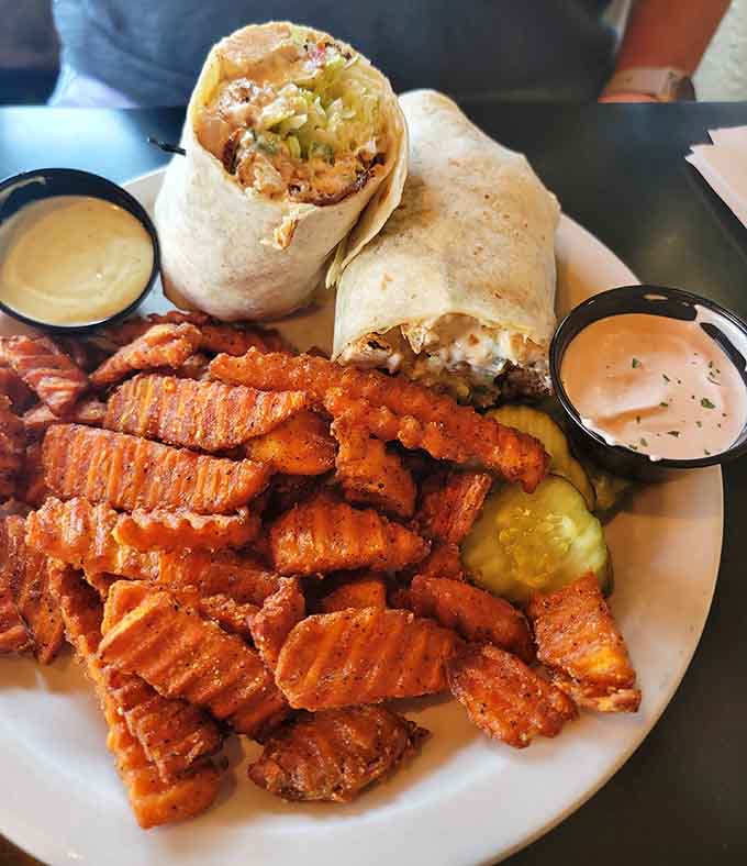 This burrito paired with perfectly seasoned waffle fries proves that sometimes the best meals are the ones you can eat with your hands.