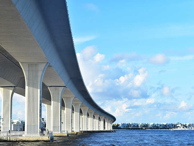 The Roosevelt Bridge curves gracefully over Stuart's waters, connecting mainland dreams to island adventures with architectural elegance.