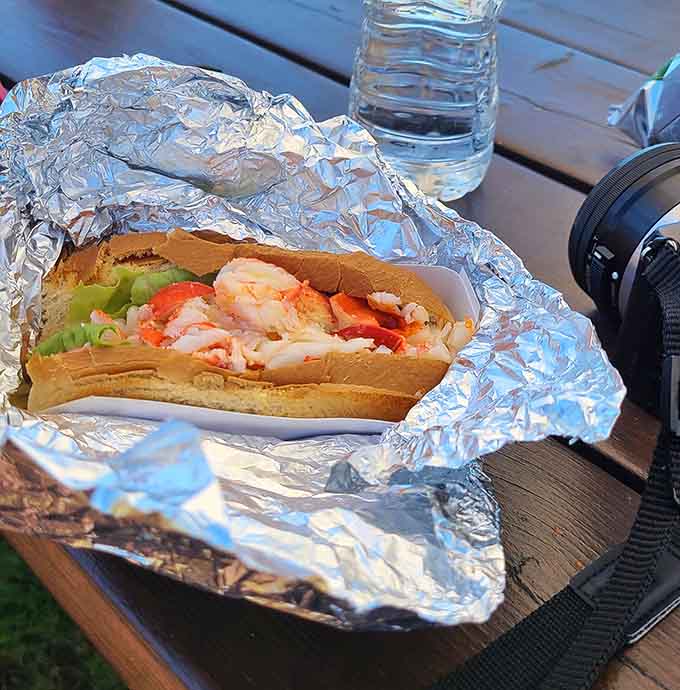 That lobster roll sitting pretty in its foil wrapper represents everything right about Maine coastal dining in one convenient package.