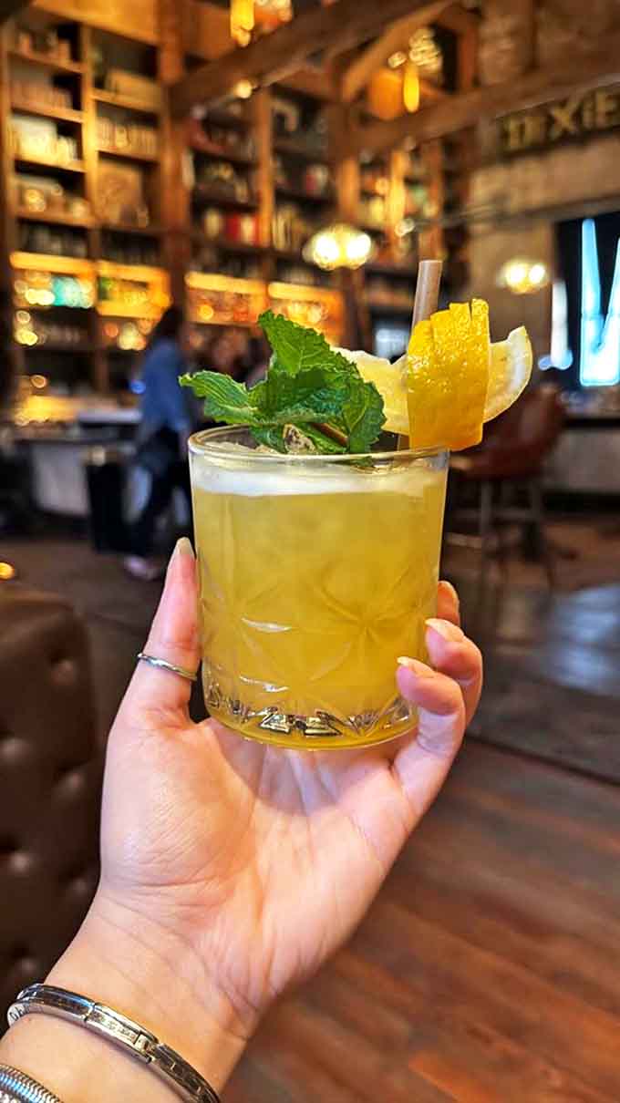 Bright citrus notes and fresh mint make this sunshine-colored libation the perfect companion for unwinding after navigating Orlando's bustling streets.