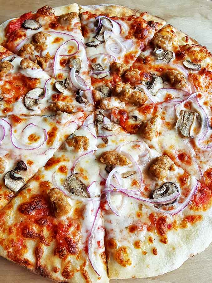 The sausage pizza showcases Sydney's commitment to quality ingredients, with each bite delivering a perfect balance of savory flavors.