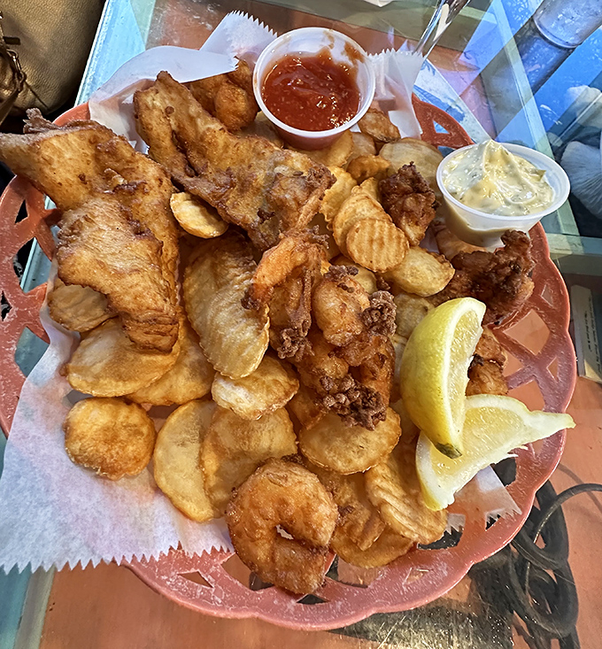 Golden-fried seafood perfection on a plate &ndash; where fish and chips ascend to art form status with fresh-caught Florida bounty.