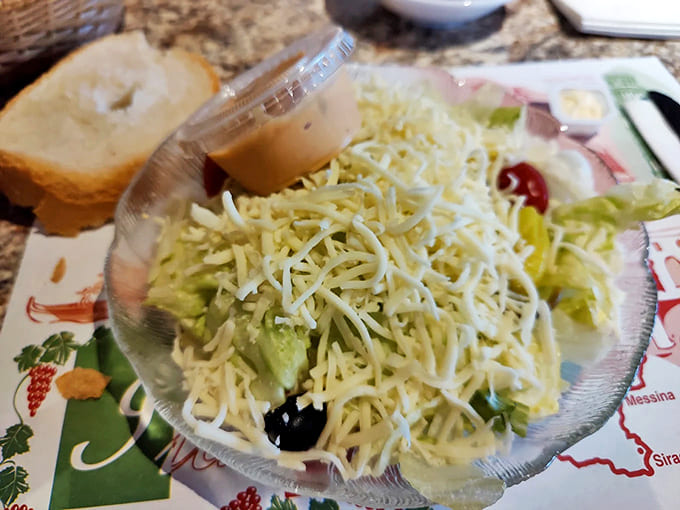 A snowfall of cheese transforms simple greens into an indulgent prelude that straddles the line between salad and appetizer.