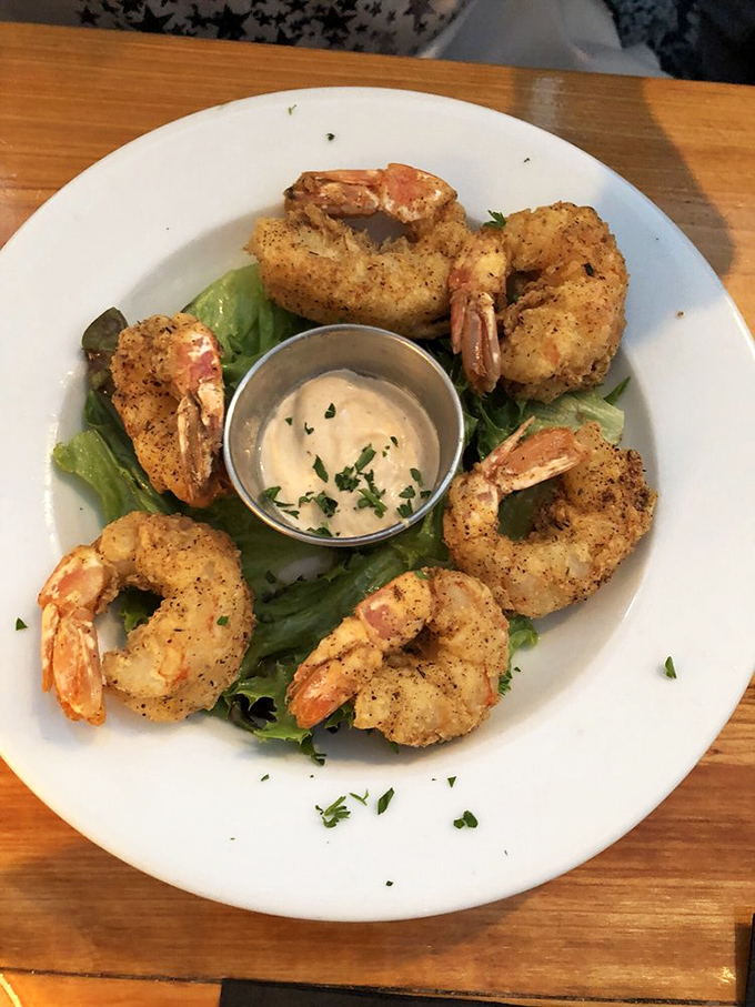 These aren't just any shrimp &ndash; they're Gulf beauties, perfectly breaded and arranged like a delicious crown around house-made dipping sauce.