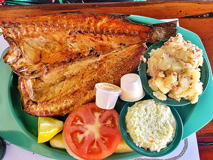 The star of the show: perfectly smoked mullet with that signature amber hue, flanked by those famous sides.