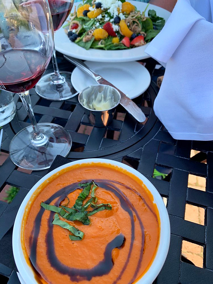 A vibrant soup alongside a fresh salad&mdash;the kind of starter duo that makes you wonder if you even need a main course (spoiler: you do).